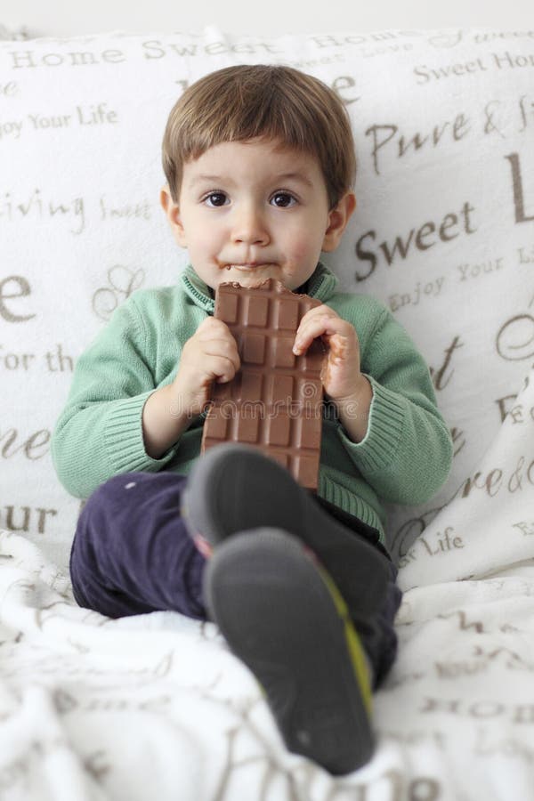 Smiling Baby Eating a Chocolate Tablet Stock Image - Image of people ...