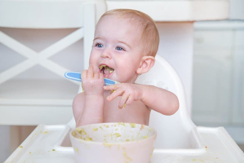 Baby Making Mess Eating Solids Stock Photos - Free & Royalty-Free Stock ...