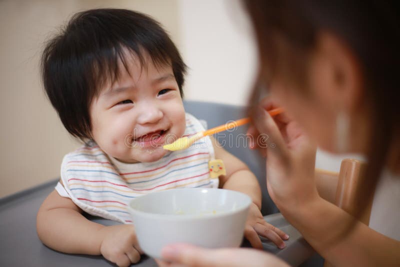 Baby eating baby food stock photo. Image of person, health - 248725114