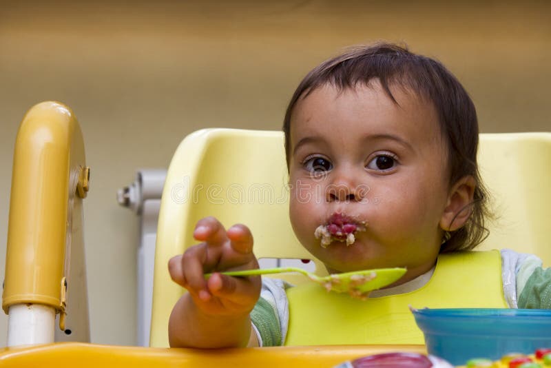 Baby Eating Food on Kitchen Stock Image - Image of eating, hand: 93469909