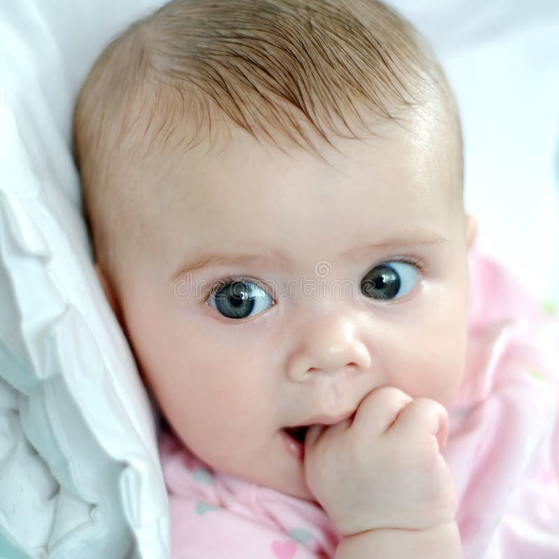 Baby eating hand stock image. Image of child, peace, relax - 16915009