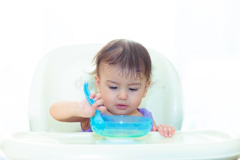 Baby Eating in the Kitchen on the Sittting on the Table Stock Photo ...