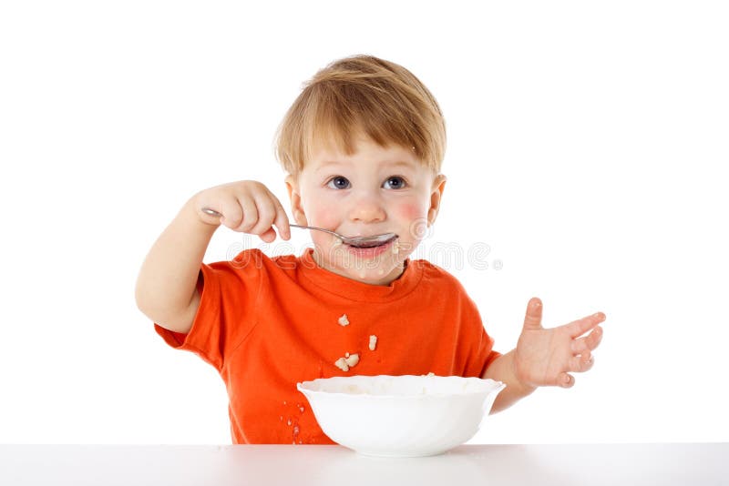 Baby eating the oatmeal stock image. Image of infant - 29055299