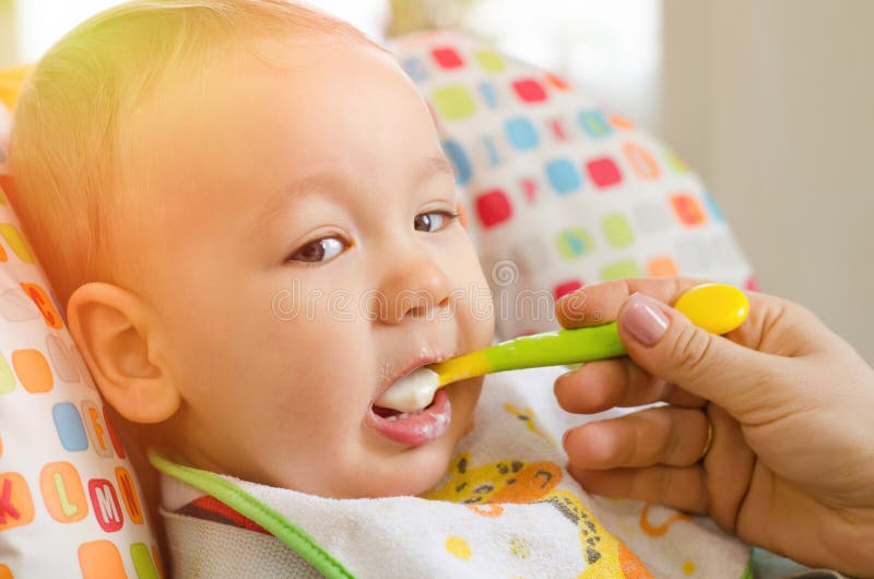 Baby eating stock photo. Image of kitchen, feeding, cute - 152604426