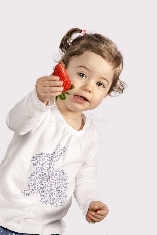 Baby eating strawberry stock image. Image of food, kids - 69463587