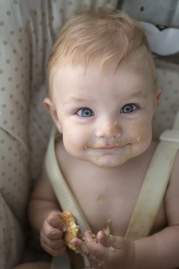 Baby eats cookies stock image. Image of love, child, cake - 35389907