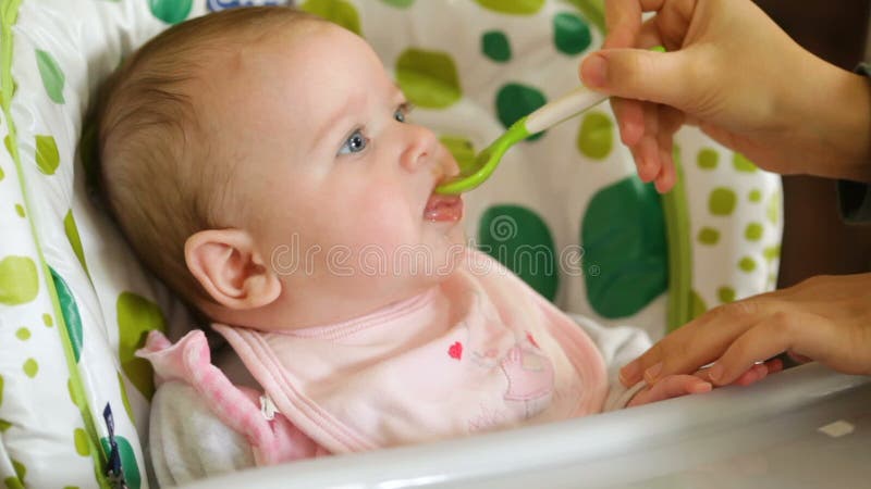 Baby Eats First Meals with Fruit. Stock Footage - Video of potty, four ...