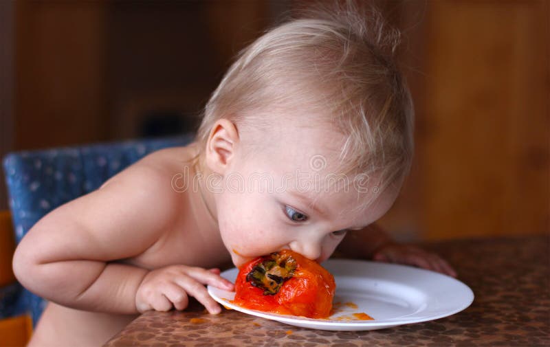 Baby Eats Fresh Ripe Persimmon on the White Plate Stock Image - Image ...