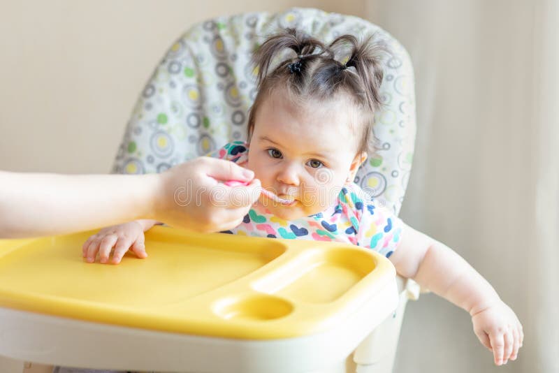 Baby Eats Mashed Potatoes, Mom Feeds Baby from a Spoon, Baby Food ...