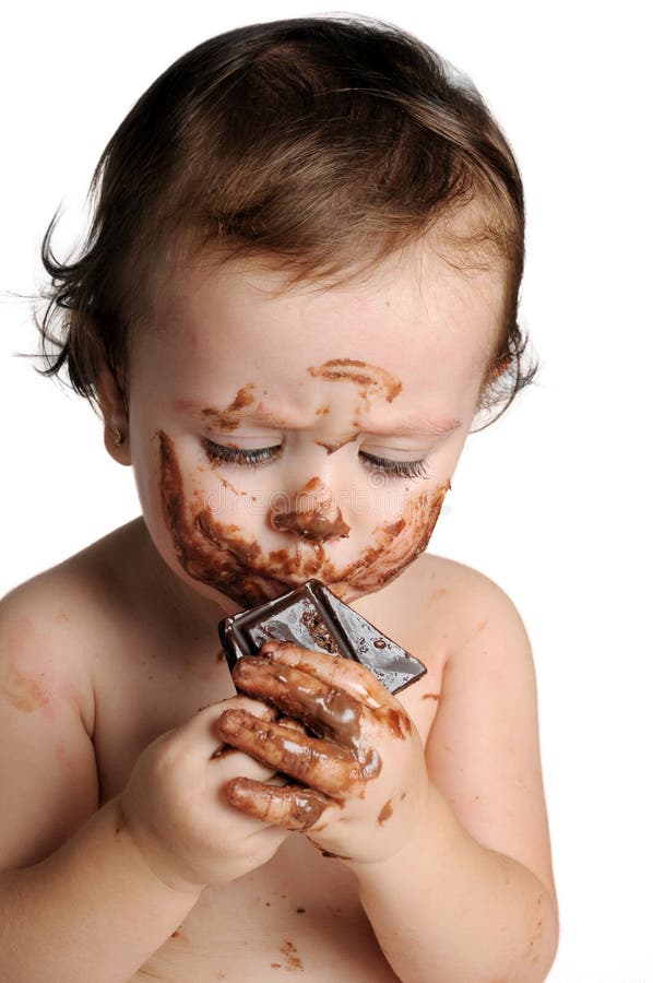 Baby Enjoying the Moment, Eating Chocolate Stock Photo - Image of cheek ...