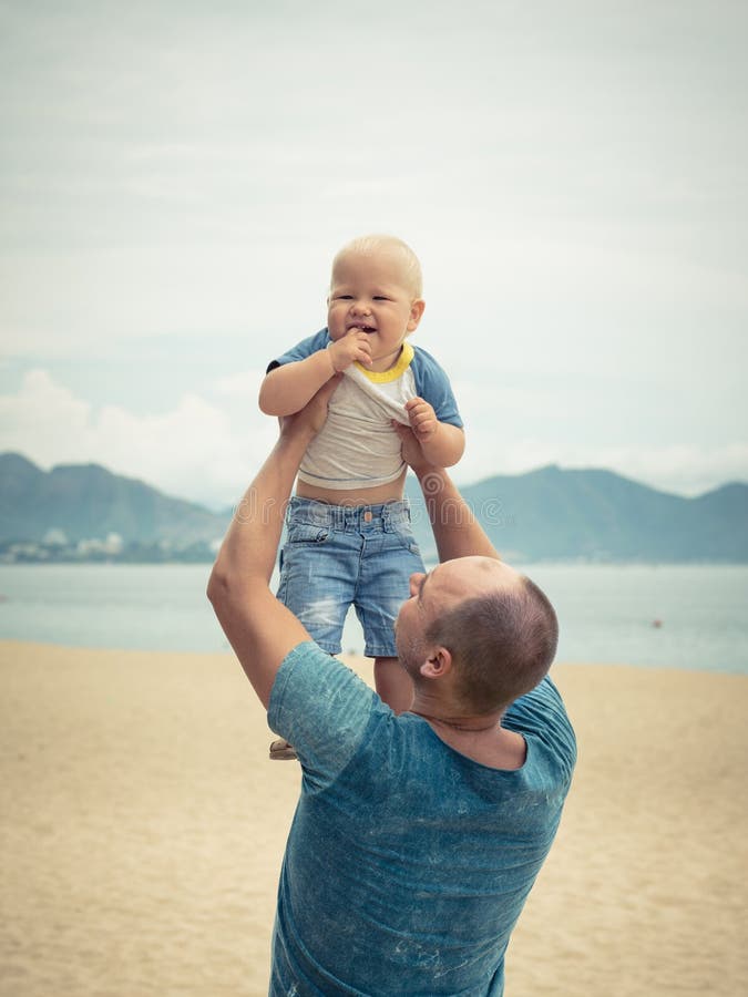 Baby and father stock image. Image of holding, active - 44825429