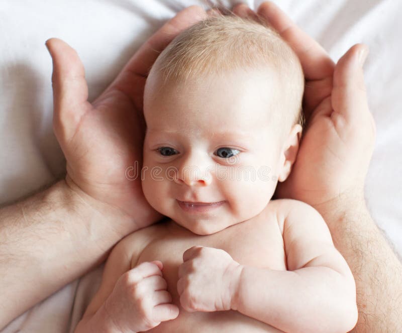 Baby in father`s hands stock photo. Image of portrait - 170666046