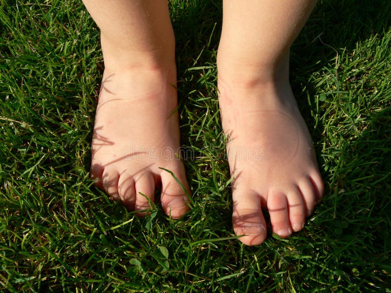 Baby feet on grass stock photo. Image of green, child - 72769214