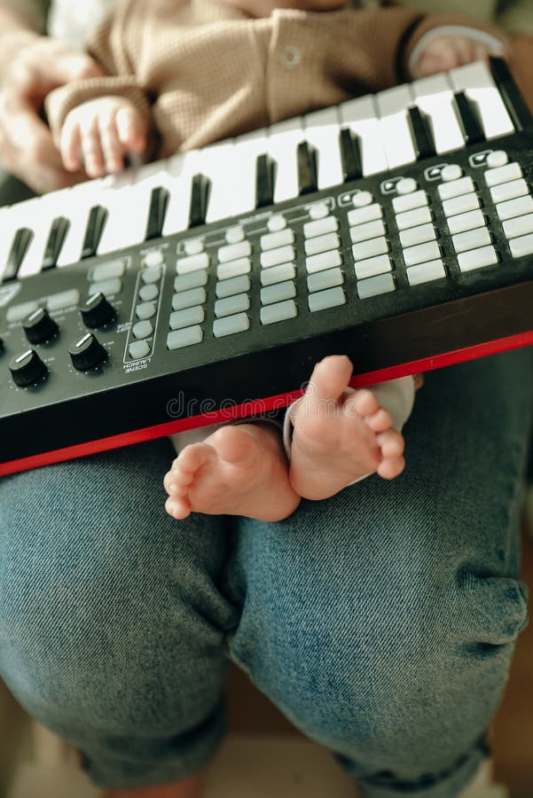 Baby Feet and Piano. Musical Baby Concept Stock Photo - Image of ...