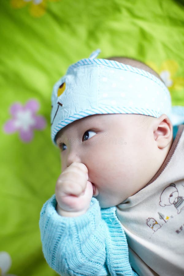 Baby with finger in mouth stock photo. Image of face - 39870268