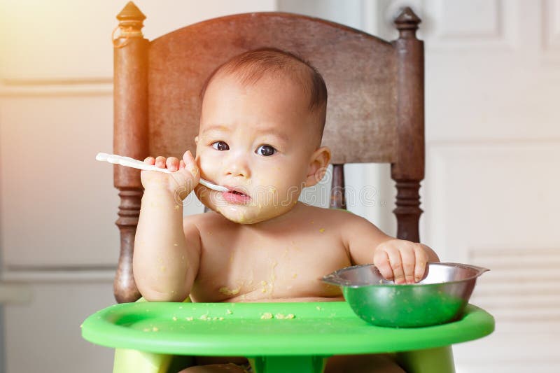Baby First meal stock image. Image of kitchen, adorable - 105327183