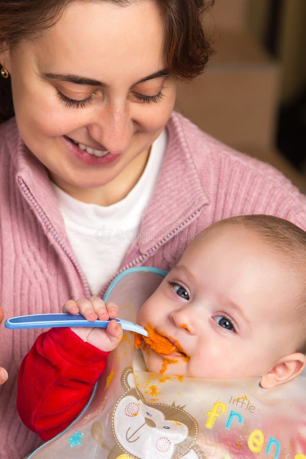 Baby First Time Eating Alone Stock Photo - Image of adorable, lunch ...