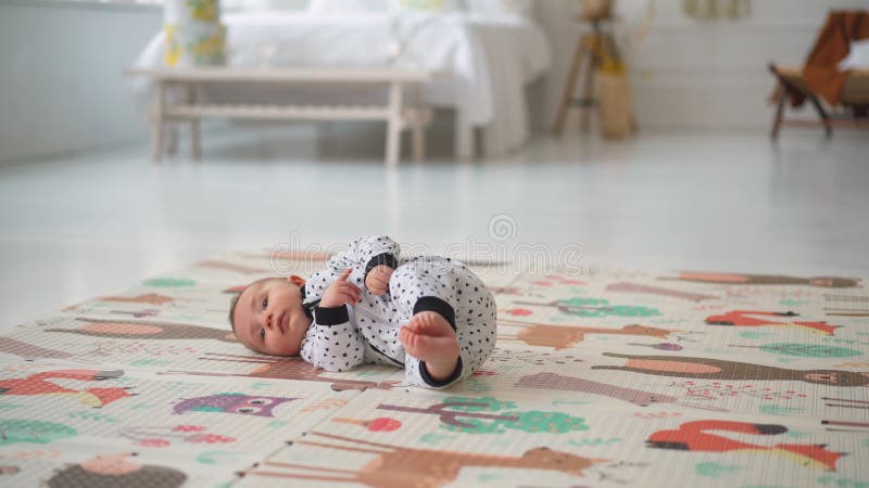 Baby First Turn Over Exercise . Cute Little Baby Turn on the Belly on ...