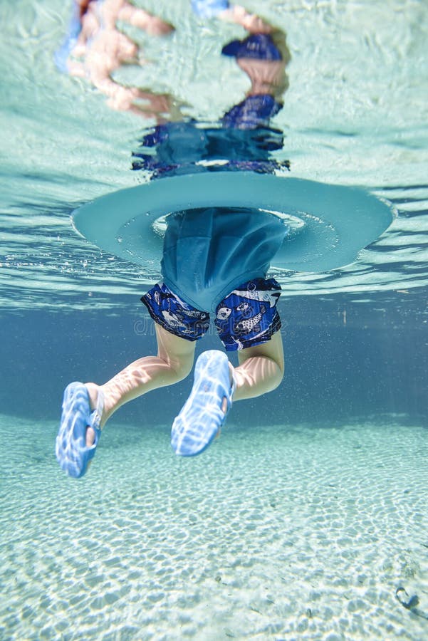 Baby Floating in the Middle of the Sea Stock Photo - Image of ...