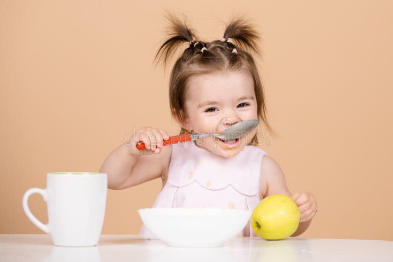 Baby Food, Babies Eating. Little Baby Eating Fruit Puree. Stock Photo ...