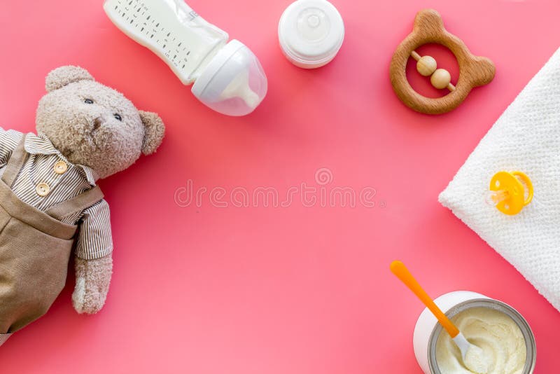 Baby Food Background with Toys and Accessories on Pink Table Top View ...