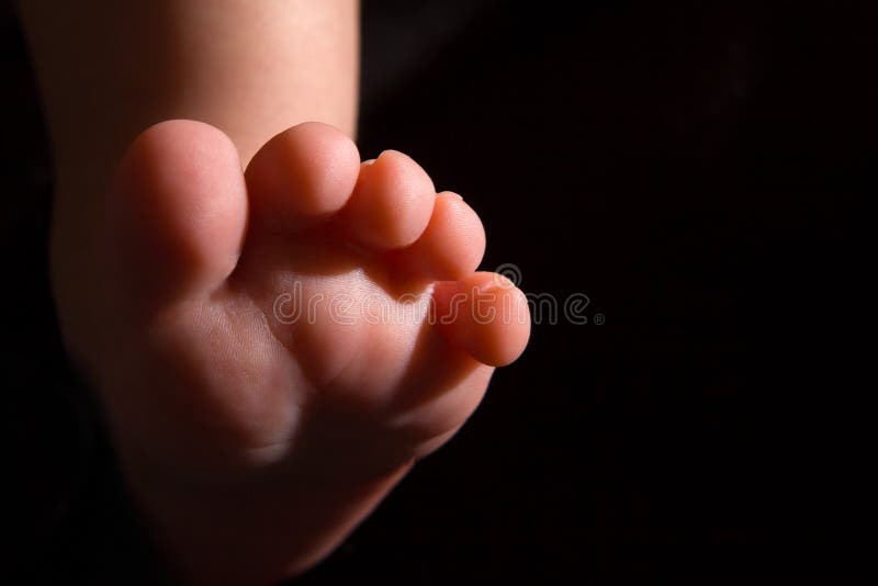 Baby Foot On Black Background Stock Photo - Image of healthy, serene ...