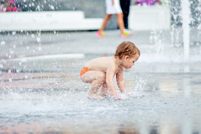 Baby in the fountain stock photo. Image of leisure, boys - 69113908