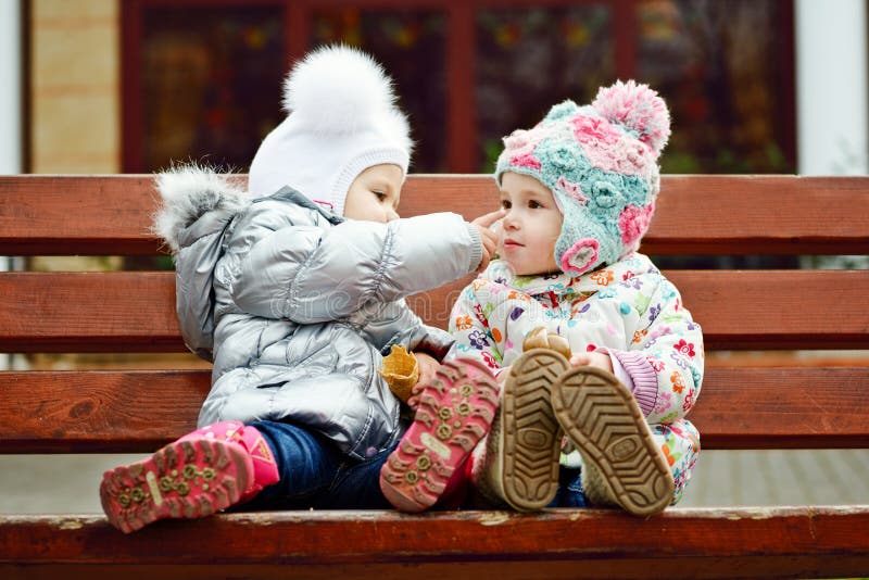 Baby friends on the bench stock image. Image of outdoors - 57166749