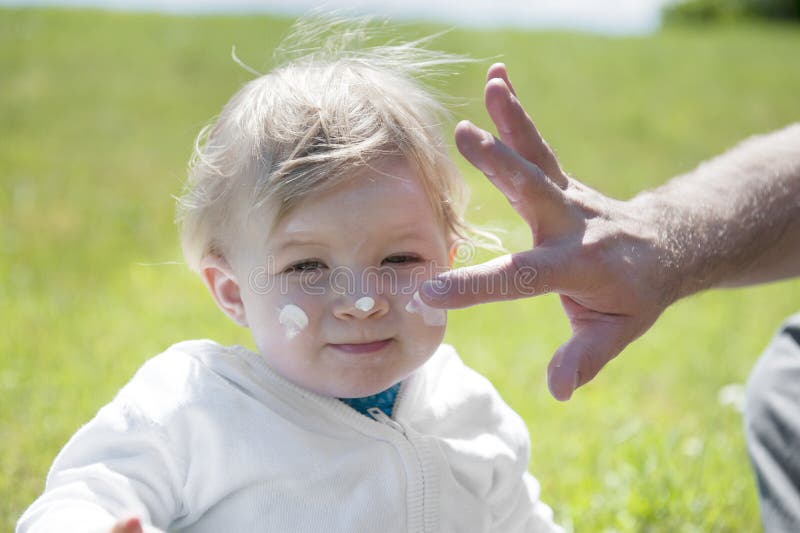 Baby Getting Suncream on Her Face Stock Photo - Image of caucasian ...