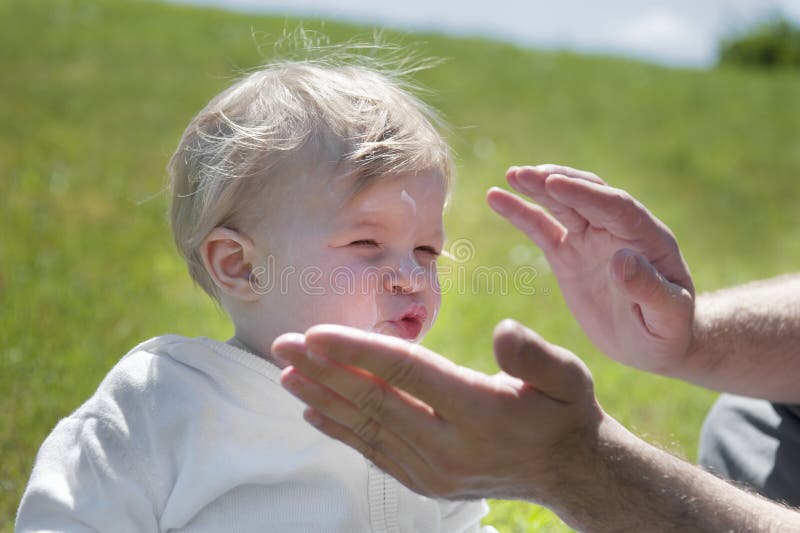 Baby Getting Suncream on Her Face Stock Image - Image of baby, casual ...