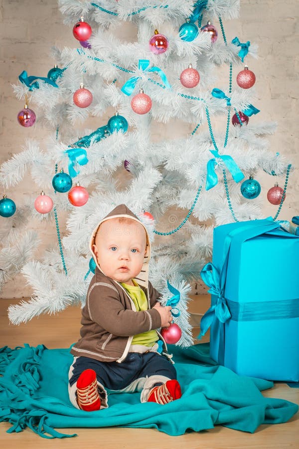 A Baby with Gifts at Christmas Tree Stock Image - Image of male ...
