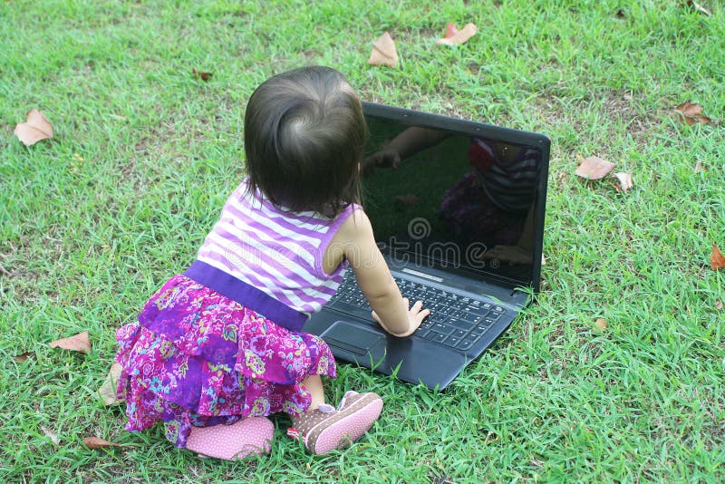 Baby Girl Asian Play Computer Stock Image - Image of cute, girl: 62637261