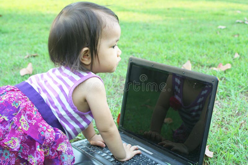 Asian Kid Play Computer Games with Funny Face Stock Photo - Image of ...