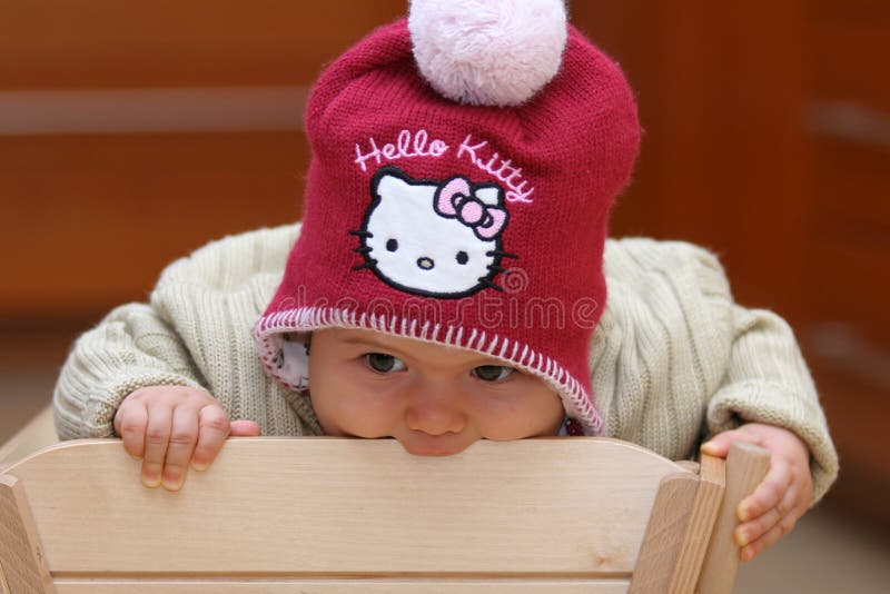 Baby girl biting chair stock image. Image of pink, child - 4857293
