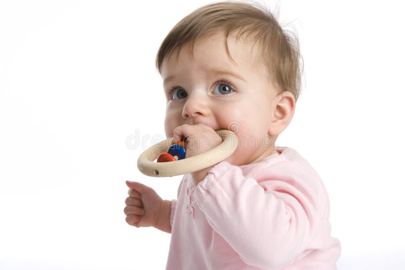 Baby Girl Biting on Toy Ring Stock Image - Image of studio, baby: 15369271