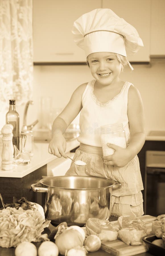 Baby Girl Cooking with Meat Stock Image - Image of chef, small: 78481663