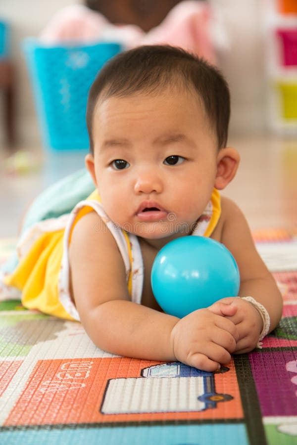 Baby Girl Crawling with Ball Stock Image - Image of love, yellow: 92406483