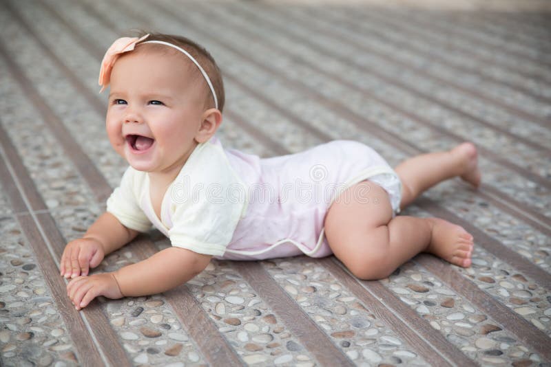 Baby girl crawling outside stock photo. Image of closeup - 88864102