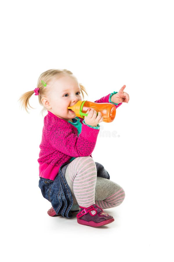 Baby girl drinking tea stock photo. Image of blond, child - 30770386