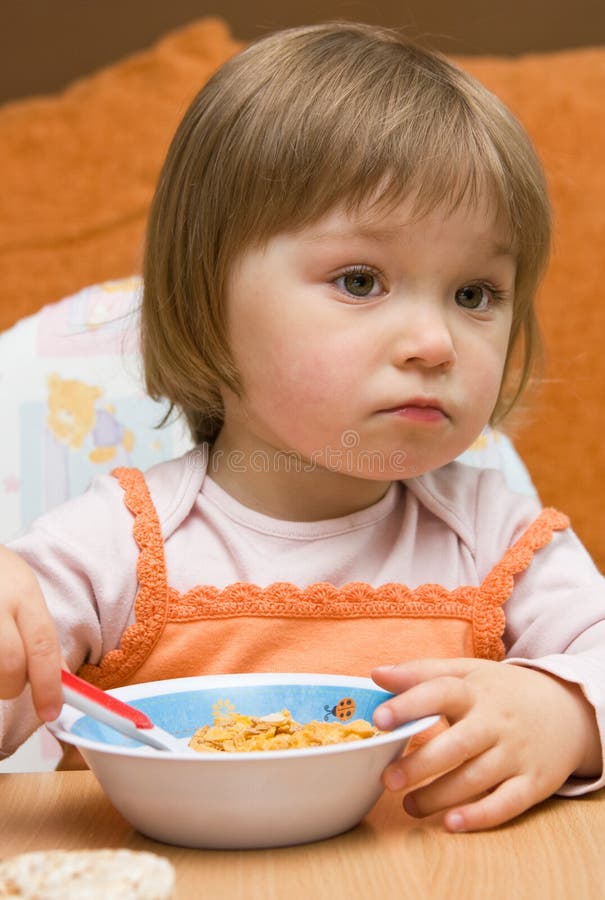 Baby girl eating stock photo. Image of family, face, home - 9933102