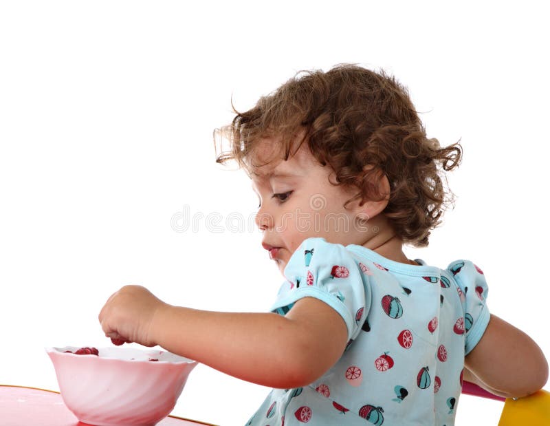 Baby girl eating cereals stock image. Image of portrait - 4889001