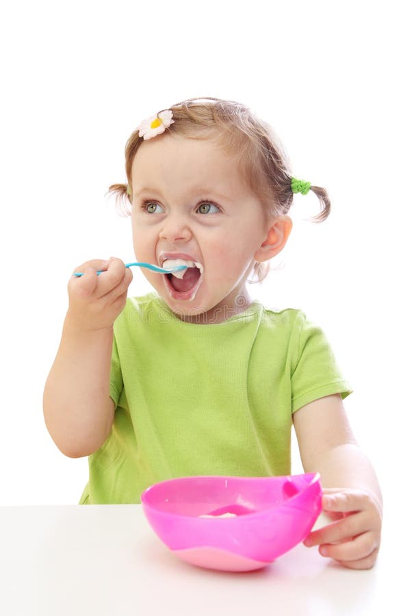 Portrait of a Little Girl Eating Yogurt. Stock Photo - Image of ...