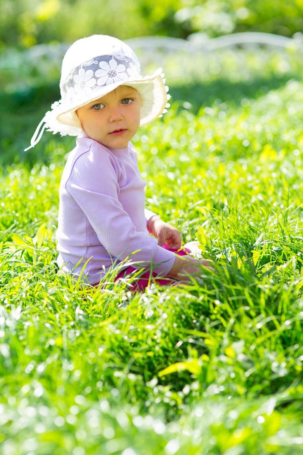 Baby girl in the garden stock photo. Image of playing - 71501882