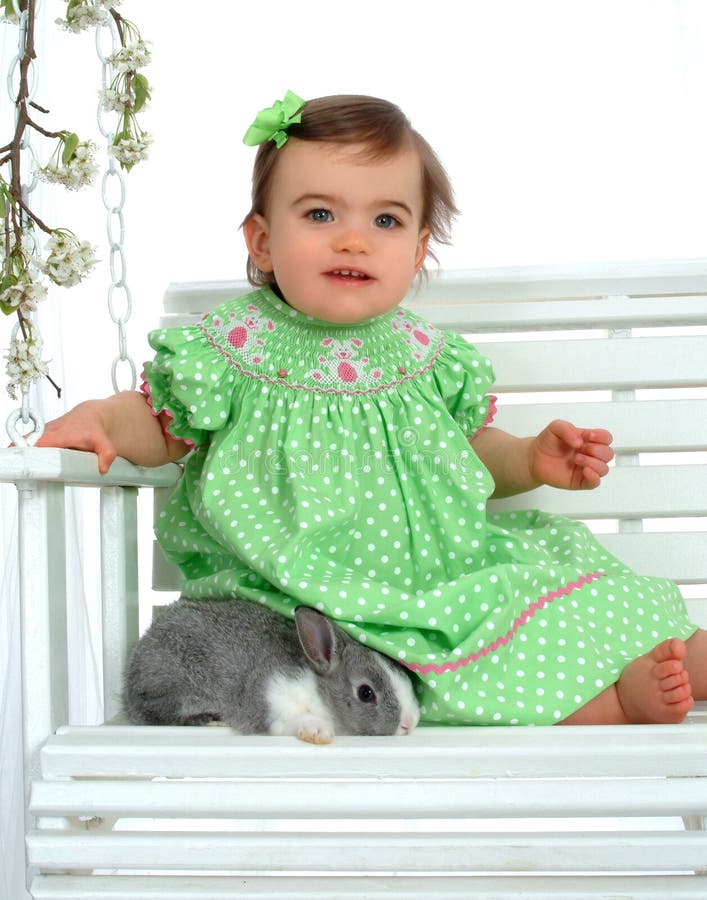 Baby Girl in Green and Bunny Stock Photo - Image of delightful, hares ...