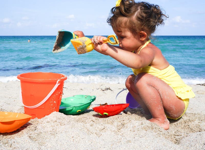Baby Girl is Having Fun at the Beach Stock Image - Image of kneeling ...