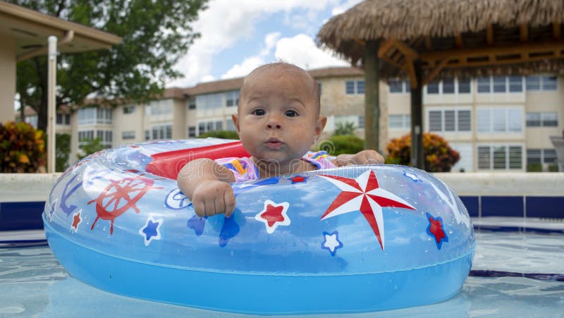 Baby girl with her float stock photo. Image of cheerful - 230313878