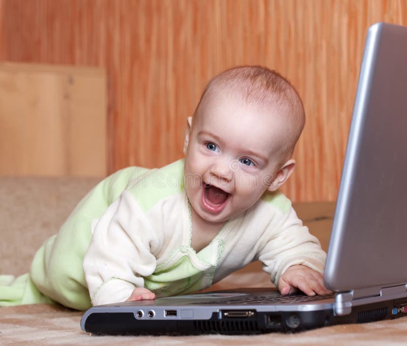 Baby Girl and Laptop stock photo. Image of toddler, pajamas - 22091420