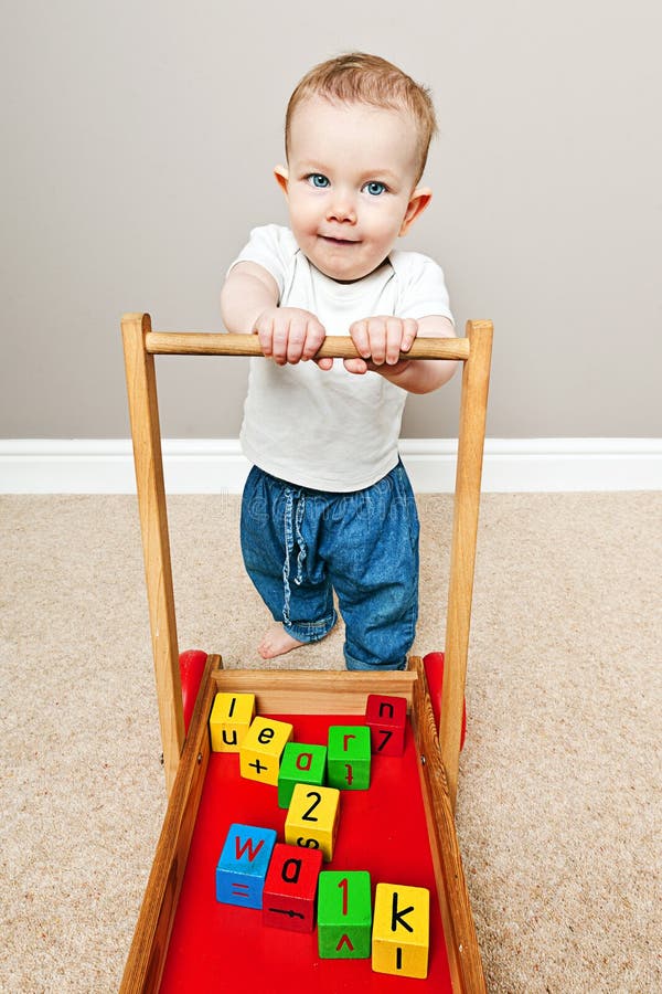 Baby Girl Learning to Walk stock photo. Image of walking - 25624750