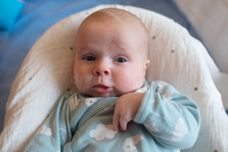 Baby Girl Looking at Camera Resting in Bed Stock Image - Image of ...