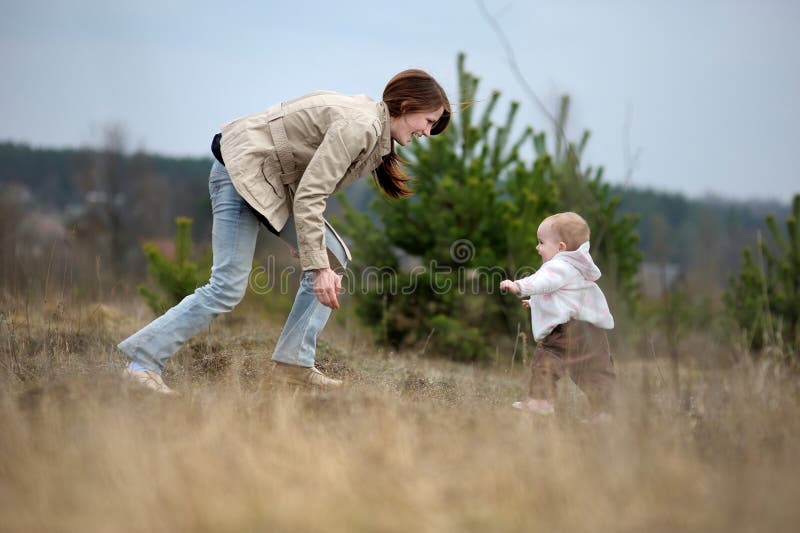 Baby Girl Making Her First Steps Stock Photo - Image of october, autumn ...